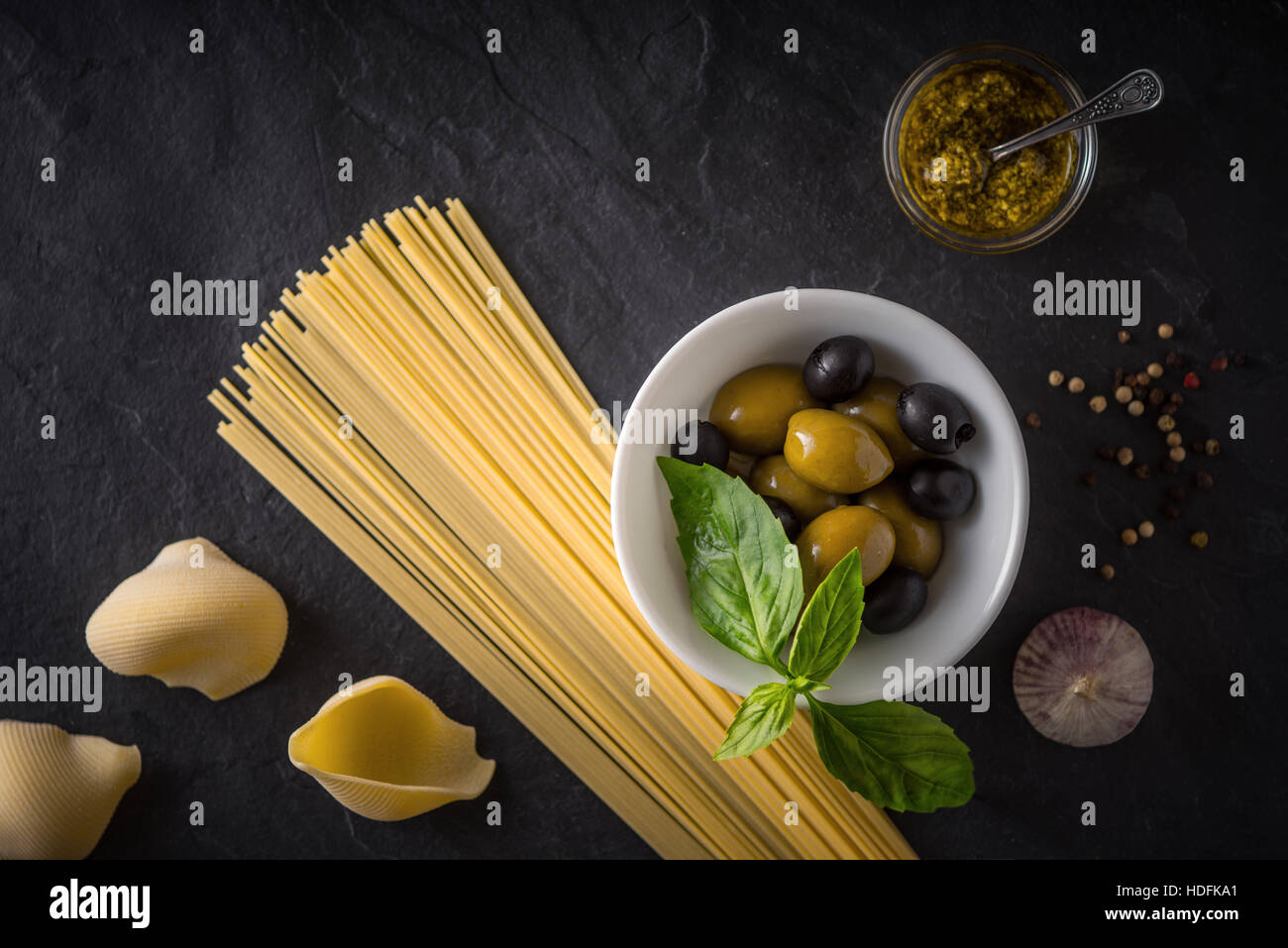 Italian food mix on the black stone table Stock Photo - Alamy
