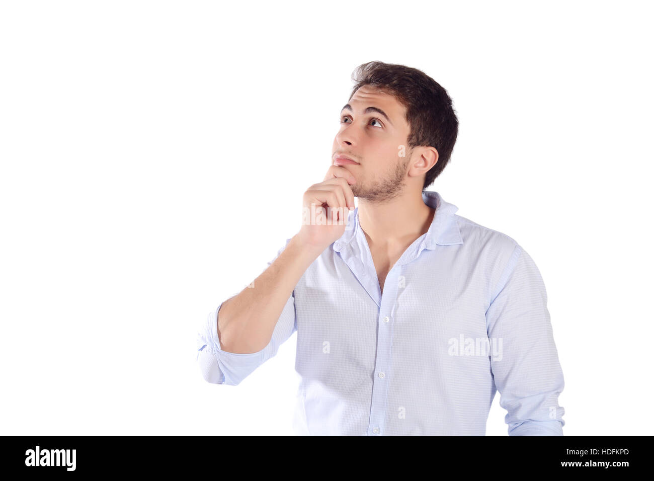 Portrait of a young thoughtful man. Isolated white background Stock ...