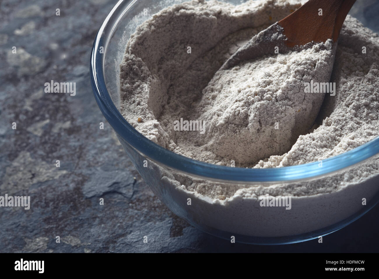 Flour in the glass bowl on the stone table horizontal Stock Photo - Alamy