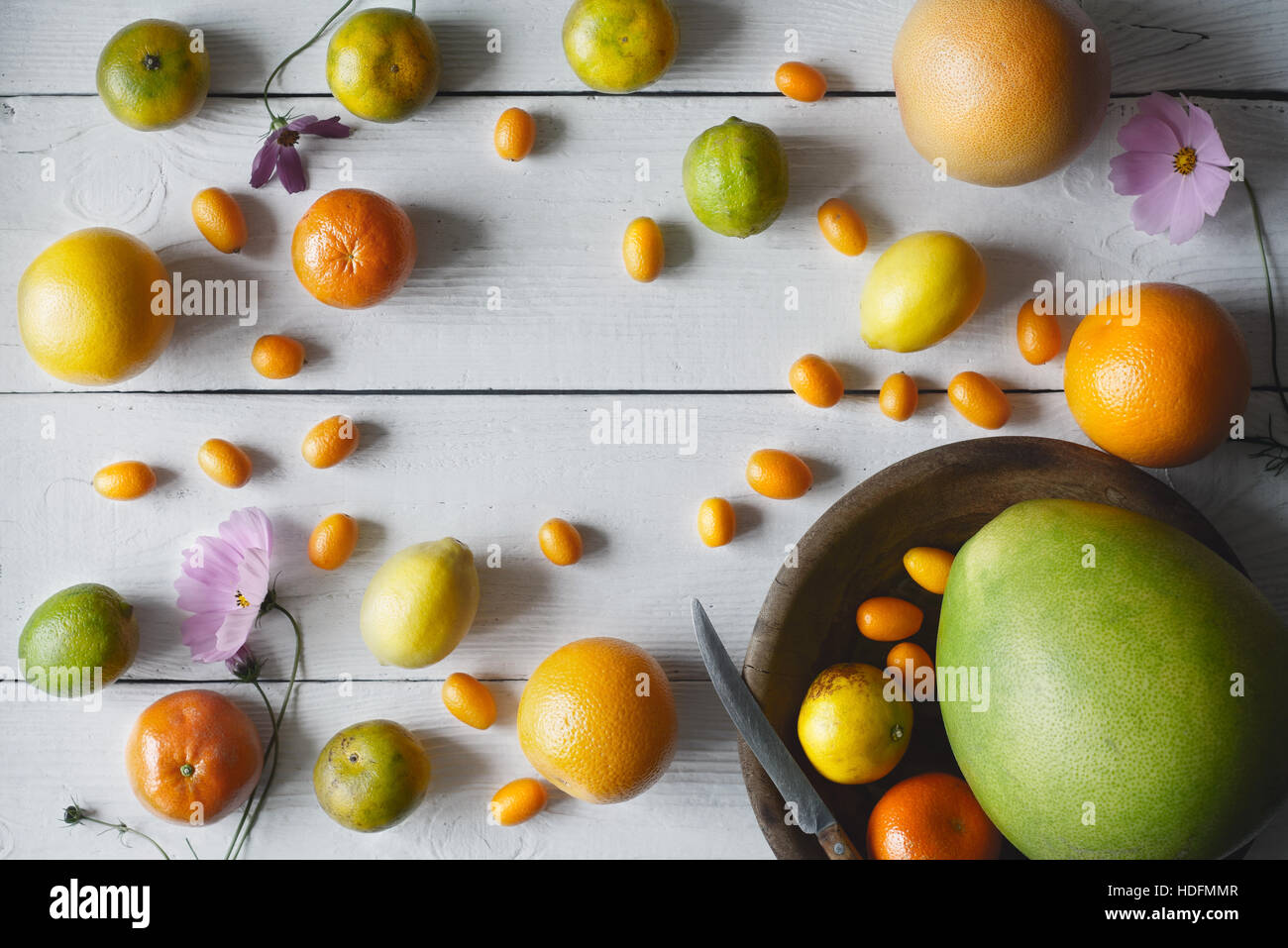 Citrus mix on the white wooden background Stock Photo - Alamy