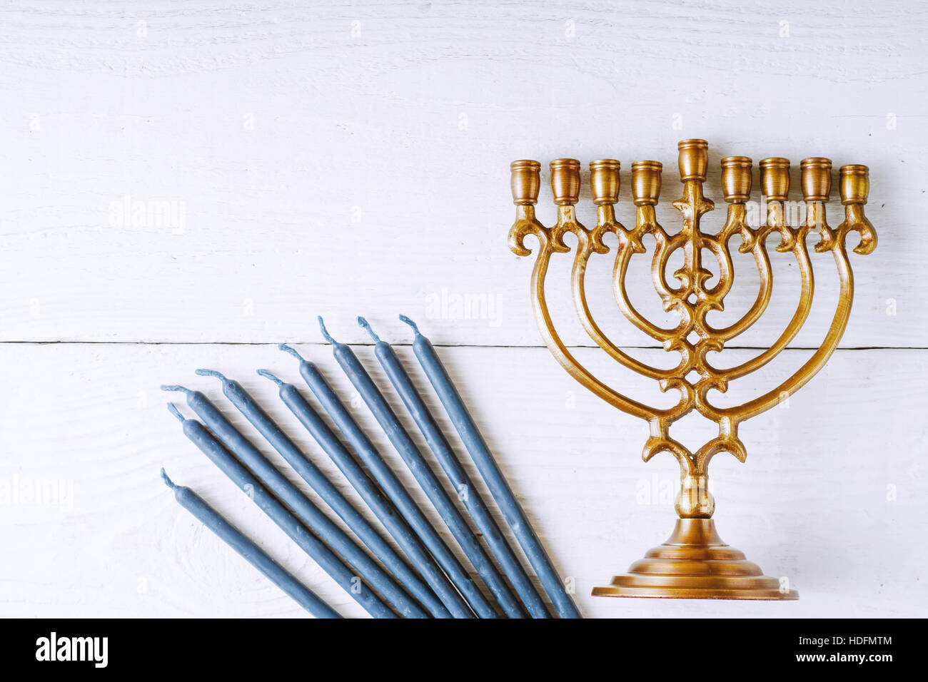Hanukkah menorah and candles on the white wooden table top view Stock ...