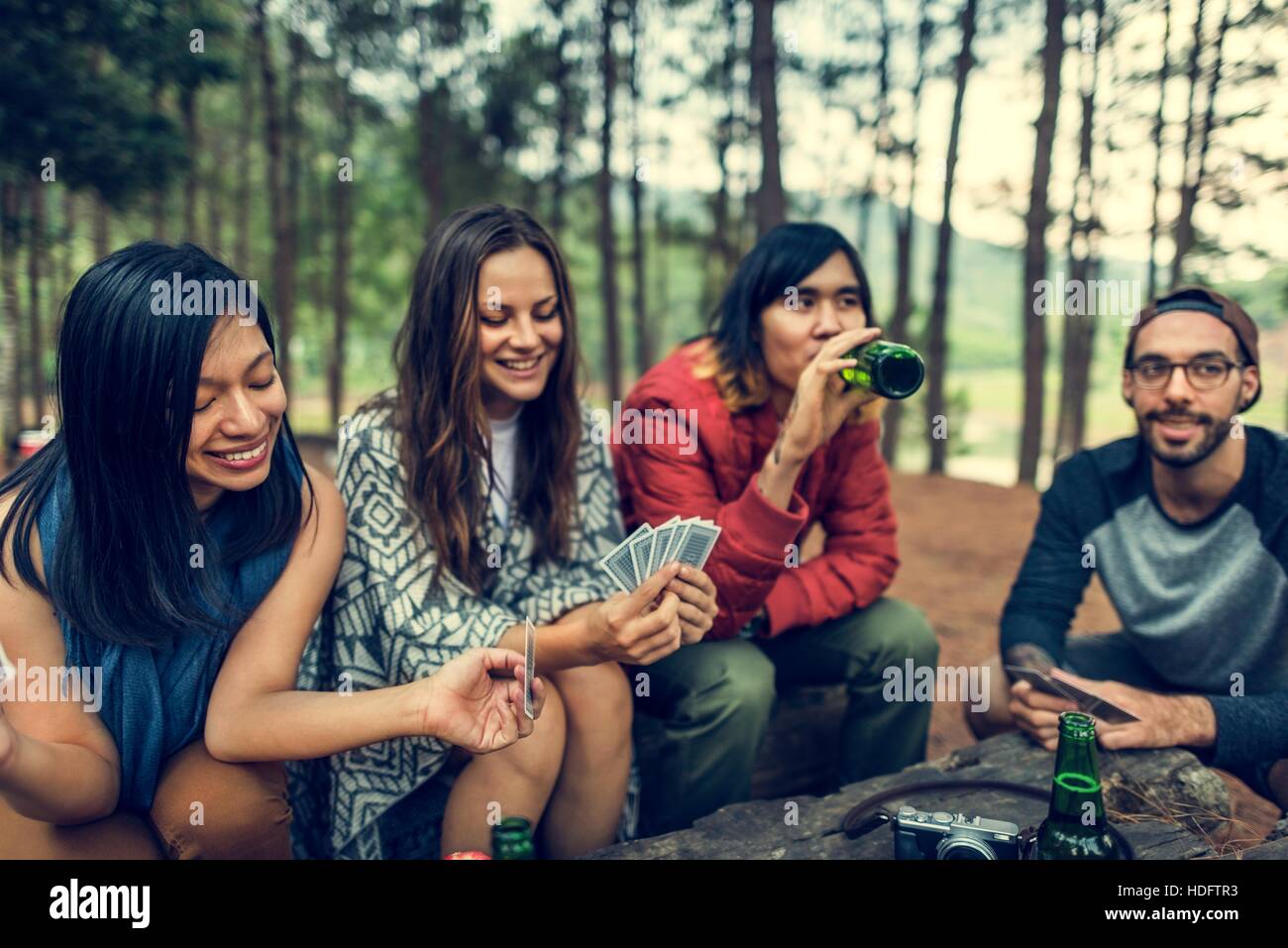 Friends Camping Playing Cards Concept Stock Photo - Alamy