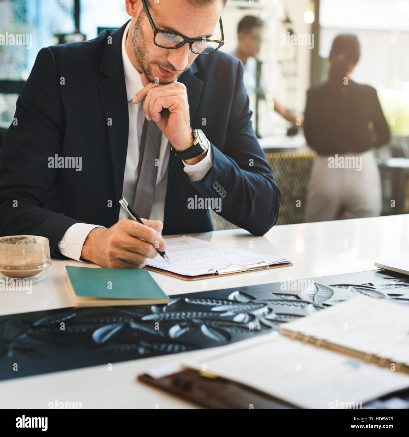 Serious Business Man Filling Out Form Concept Stock Photo - Alamy