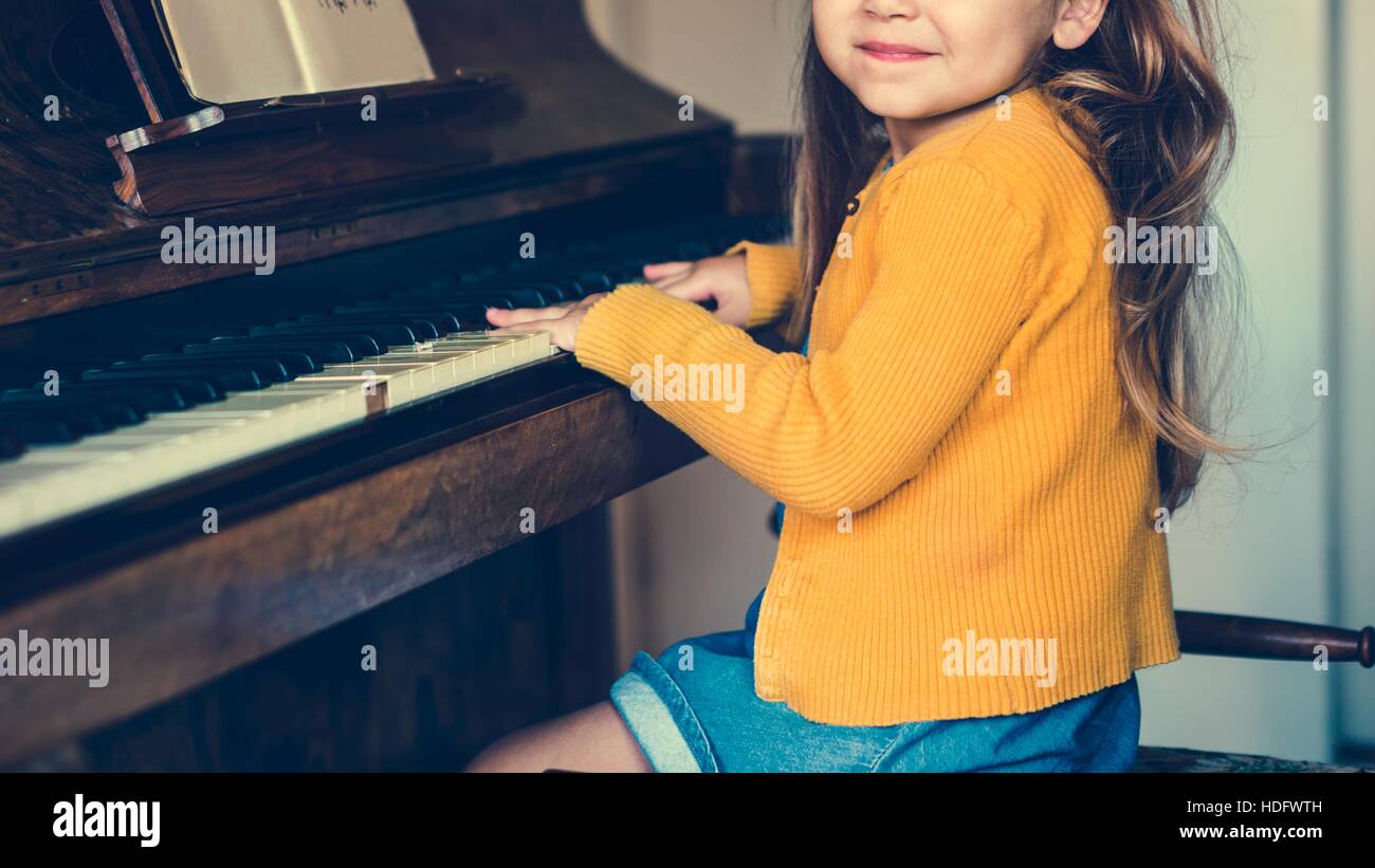 Adorable Cute Girl Playing Piano Concept Stock Photo - Alamy