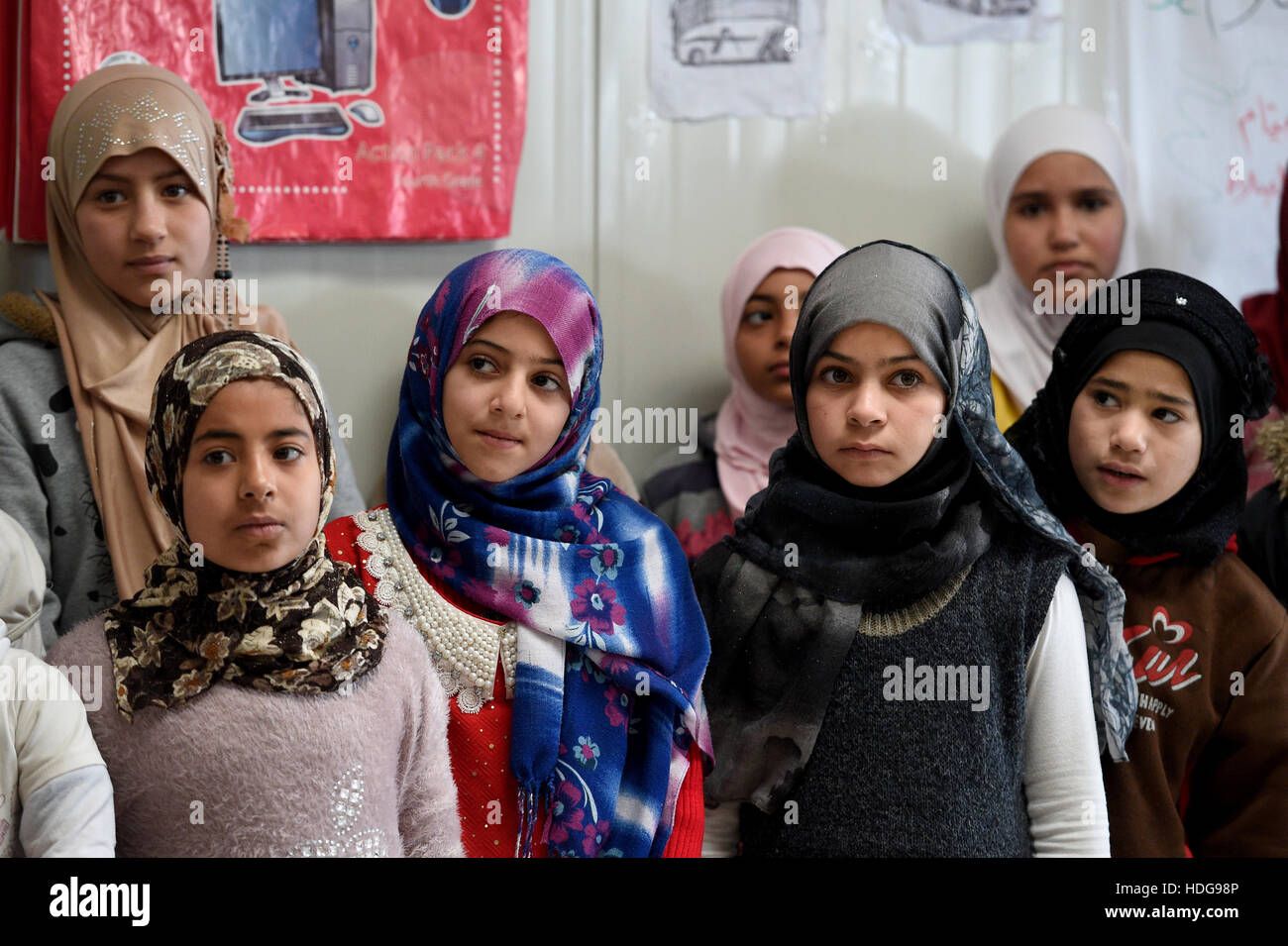 Zaatari, Jordan. 11th Dec, 2016. Young women participate in a lesson at ...