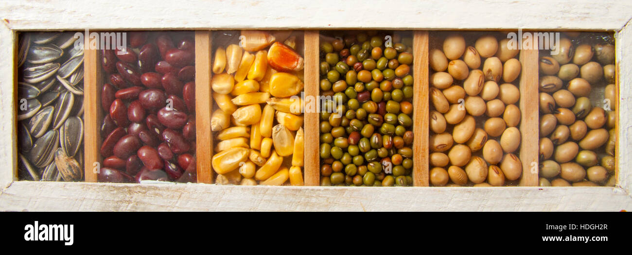Handmade wooden box with lots of beans Stock Photo - Alamy