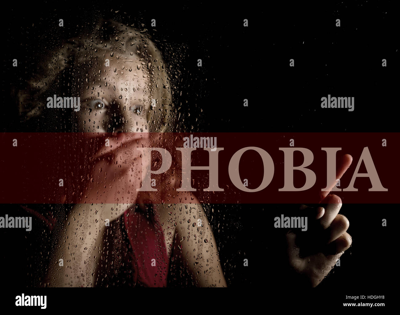 phobia written on virtual screen. hand of frightened young girl ...