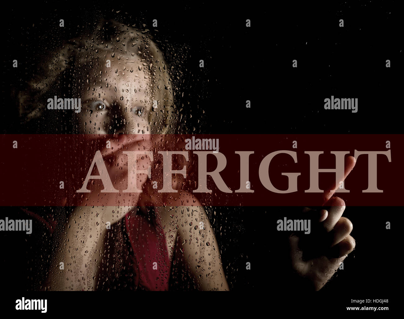 affright written on virtual screen. hand of frightened young girl ...