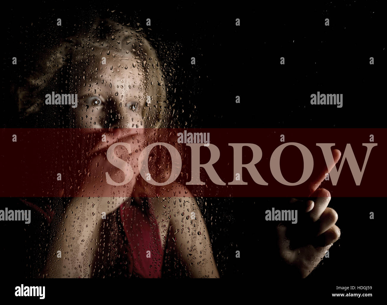 sorrow written on virtual screen. hand of frightened young girl ...