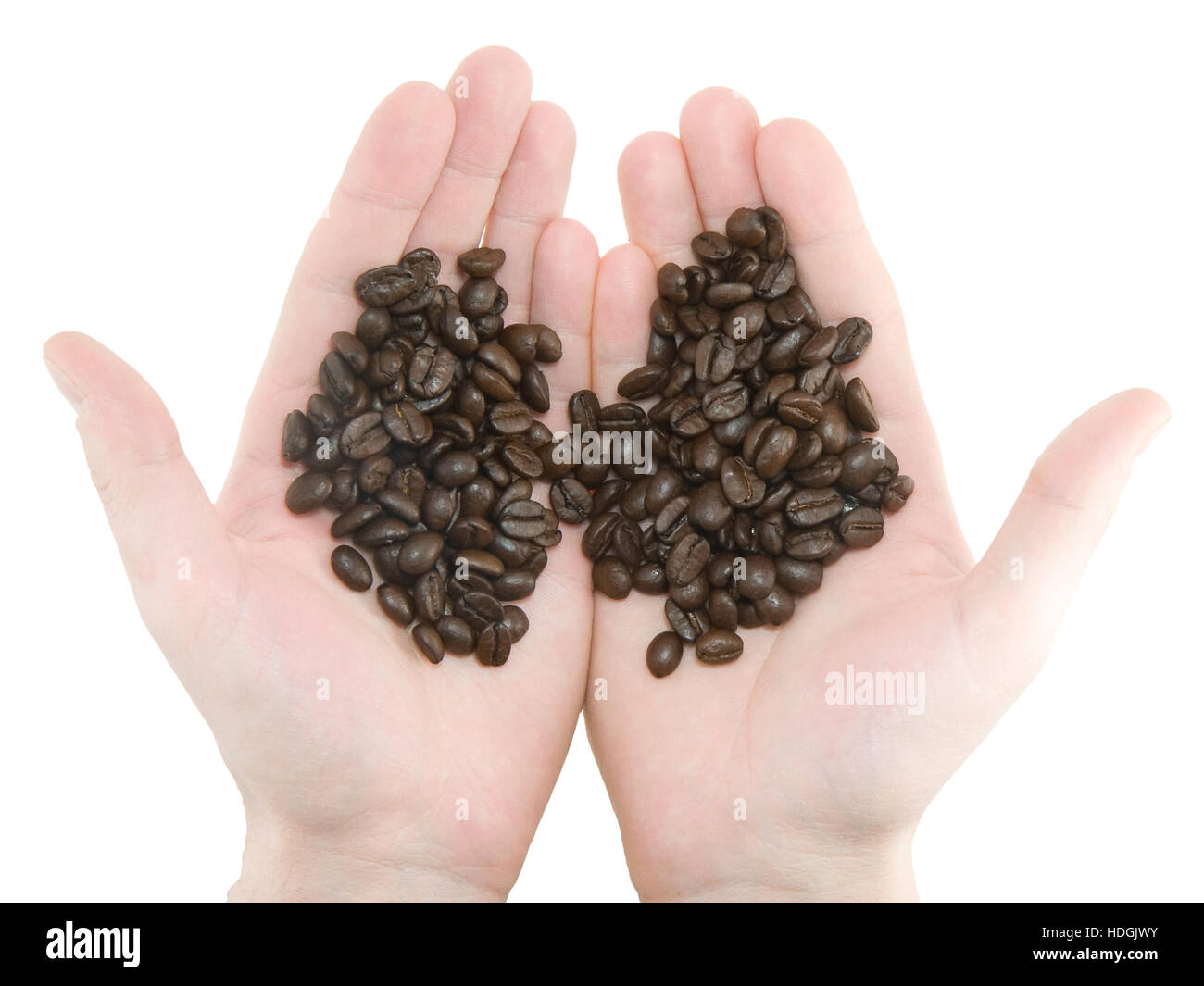 Coffee beans on a hands. Isolated on white Stock Photo - Alamy