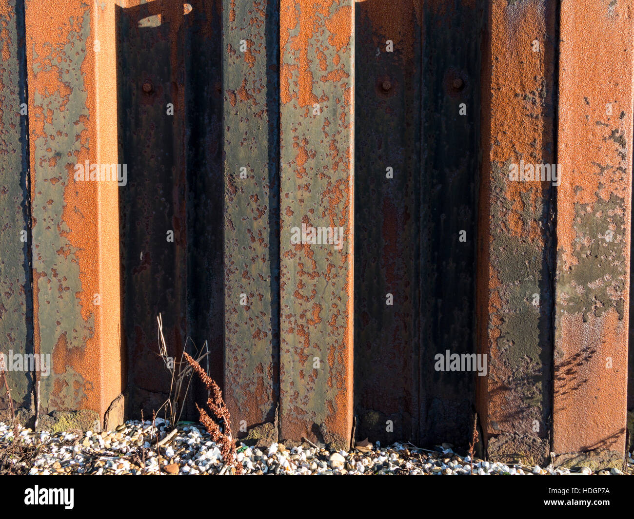 Heavily rusted and corroded steel interlocking sea defenses Stock Photo ...