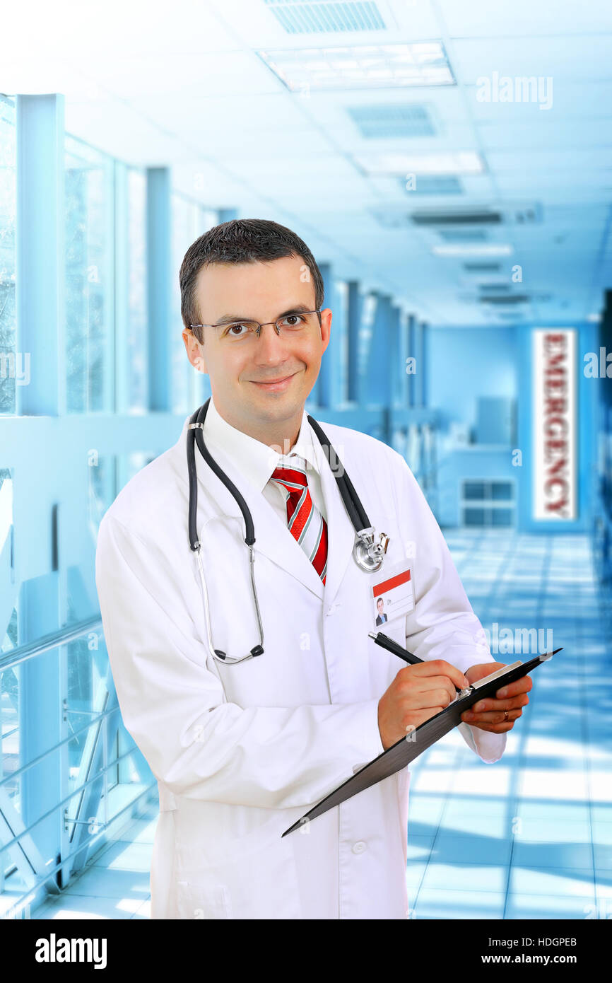 Friendly medical doctor stand in Hospital corridor Stock Photo - Alamy
