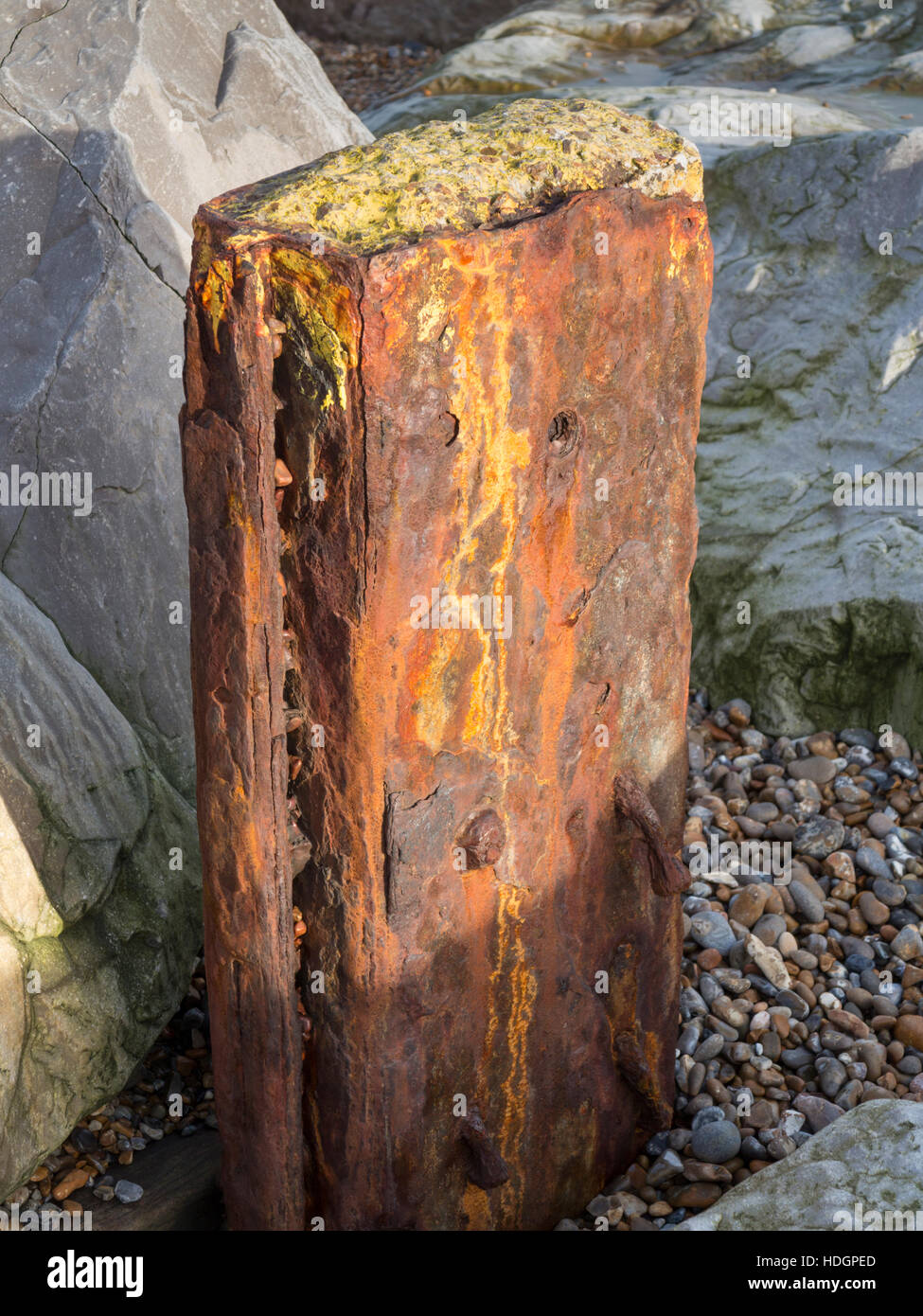 The rusted remains of sea defense structures on a pebble beach Stock ...