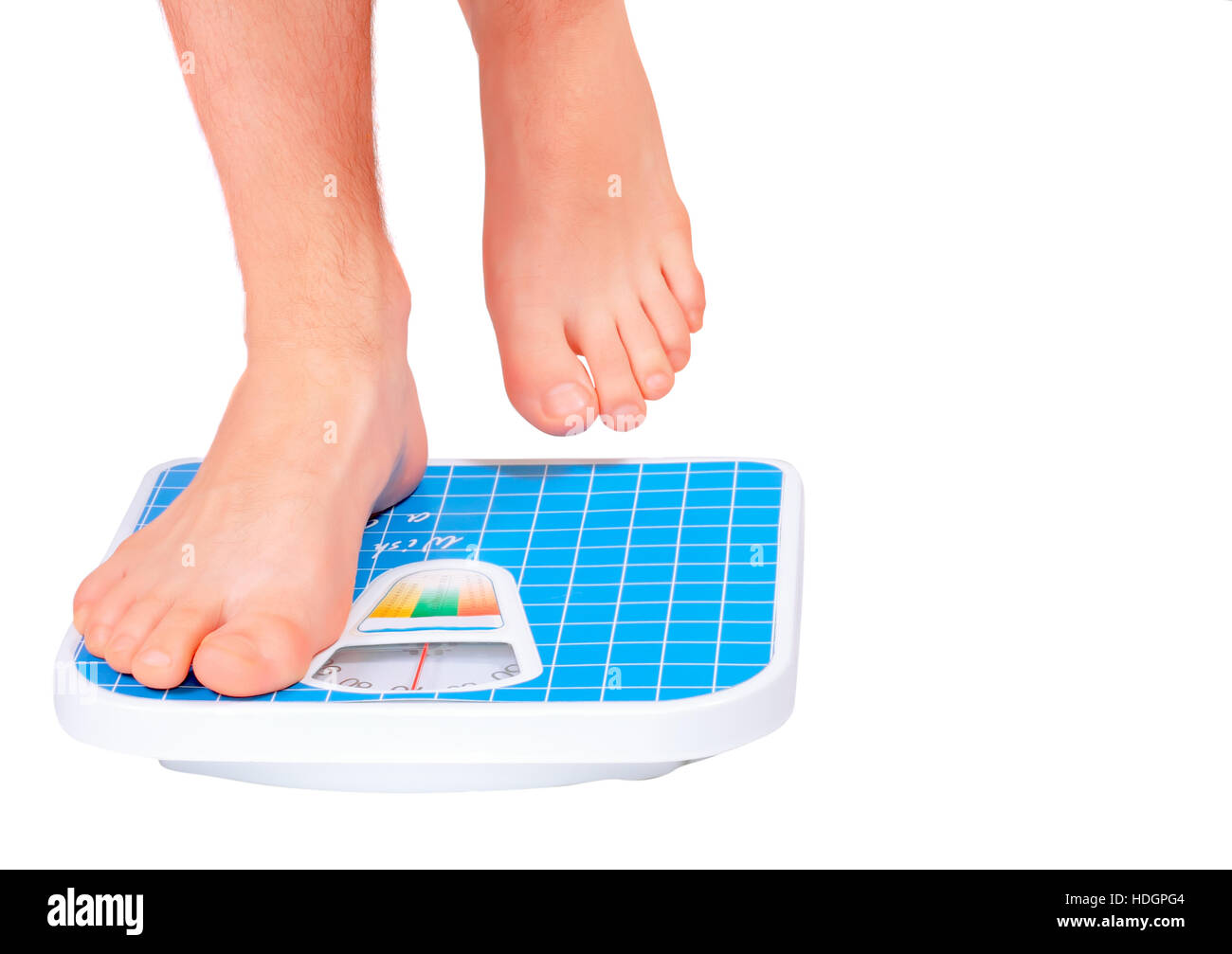 Man's legs , which weighed on floor scale. Isolated over white Stock ...