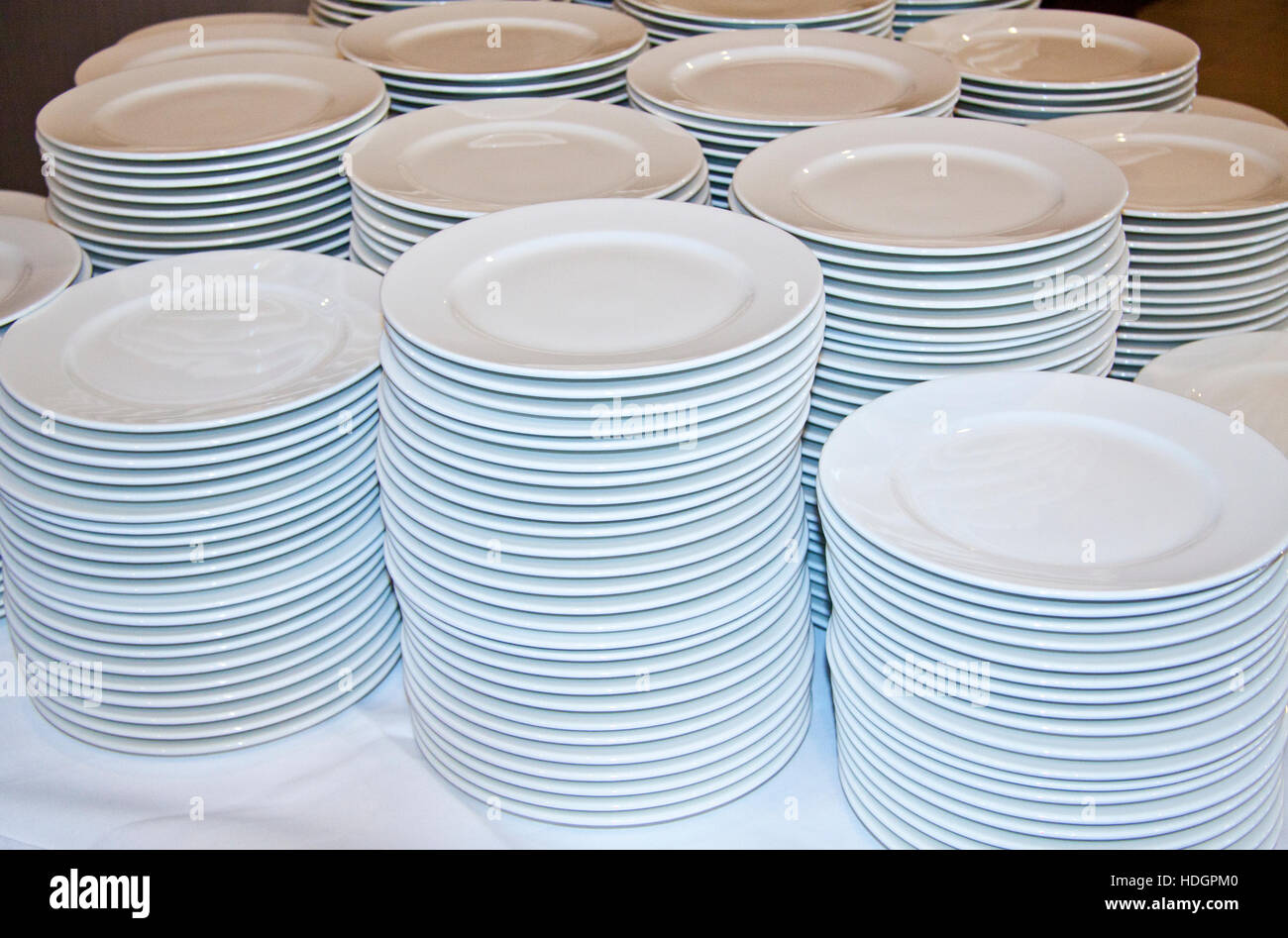 Many white plates on a pile for background use Stock Photo - Alamy