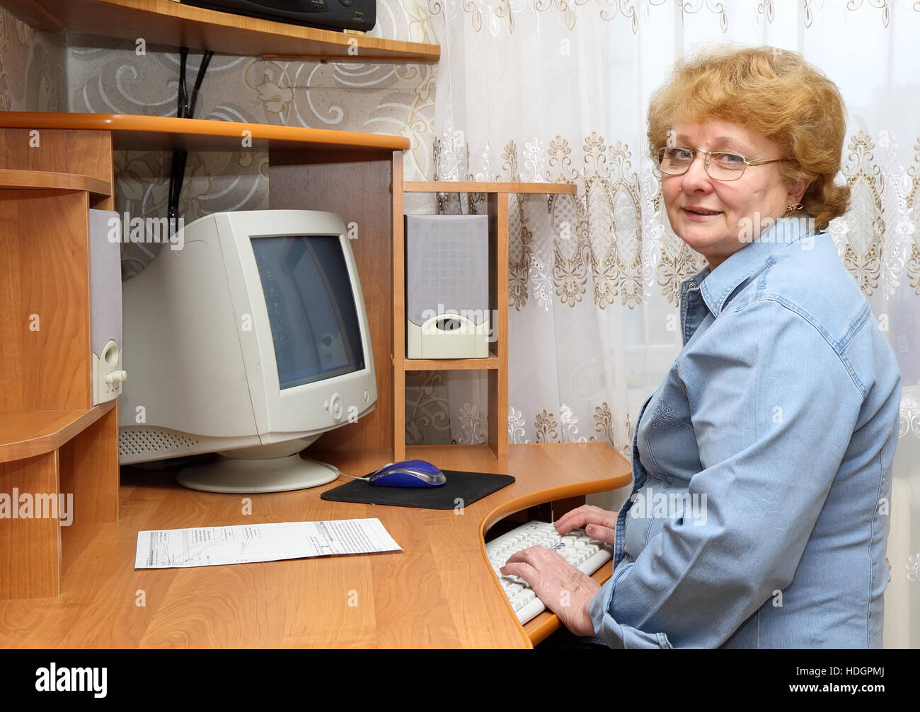 Senior lady learn a computer youself Stock Photo - Alamy