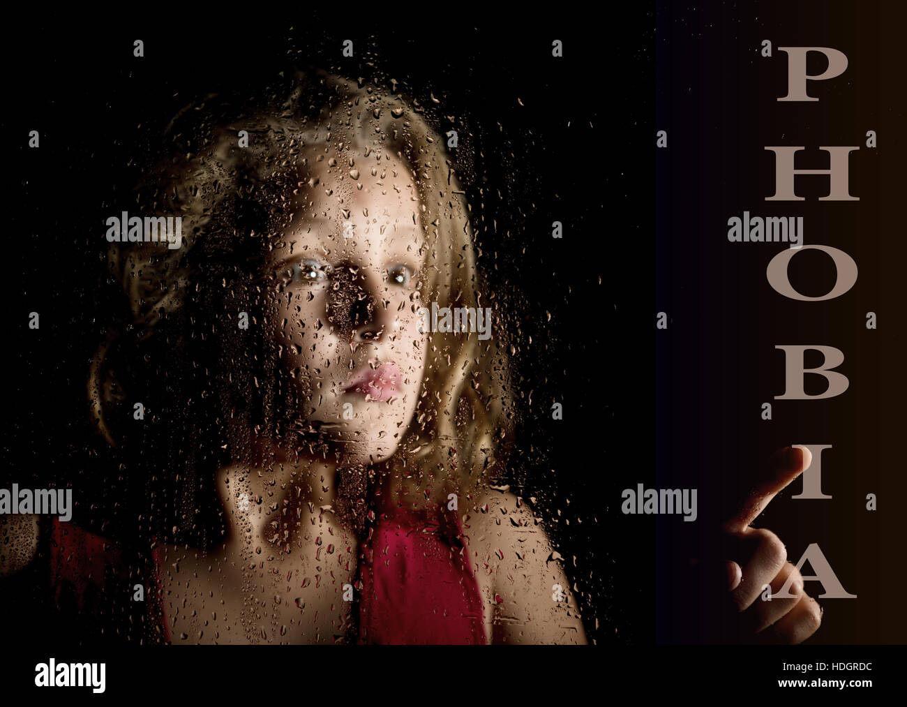 phobia written on virtual screen. hand of frightened young girl ...