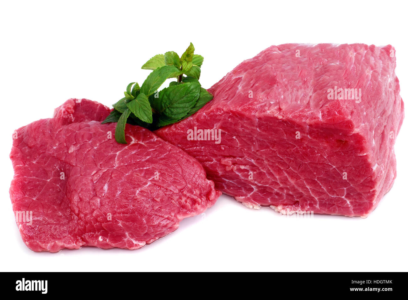 Cut of beef steak with green leaf. Isolated Stock Photo - Alamy