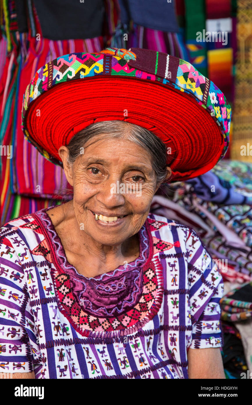 An older Mayan woman wearing traditional dress, including a tocoyal or ...