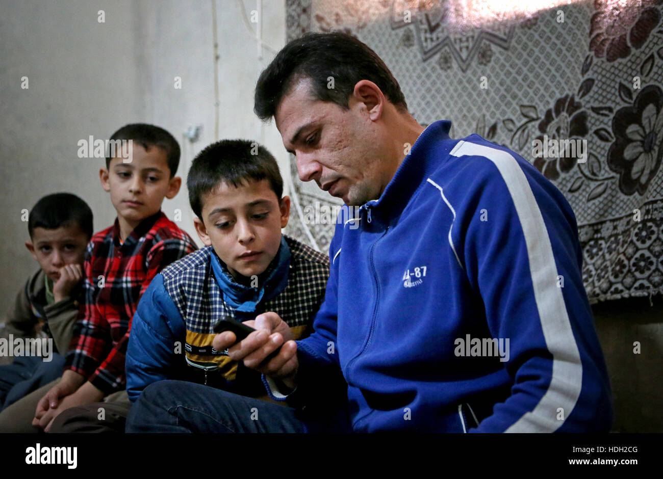 Syrian refugee Bassam Al Rahal, 30, with his sons (left to right) Ammar ...