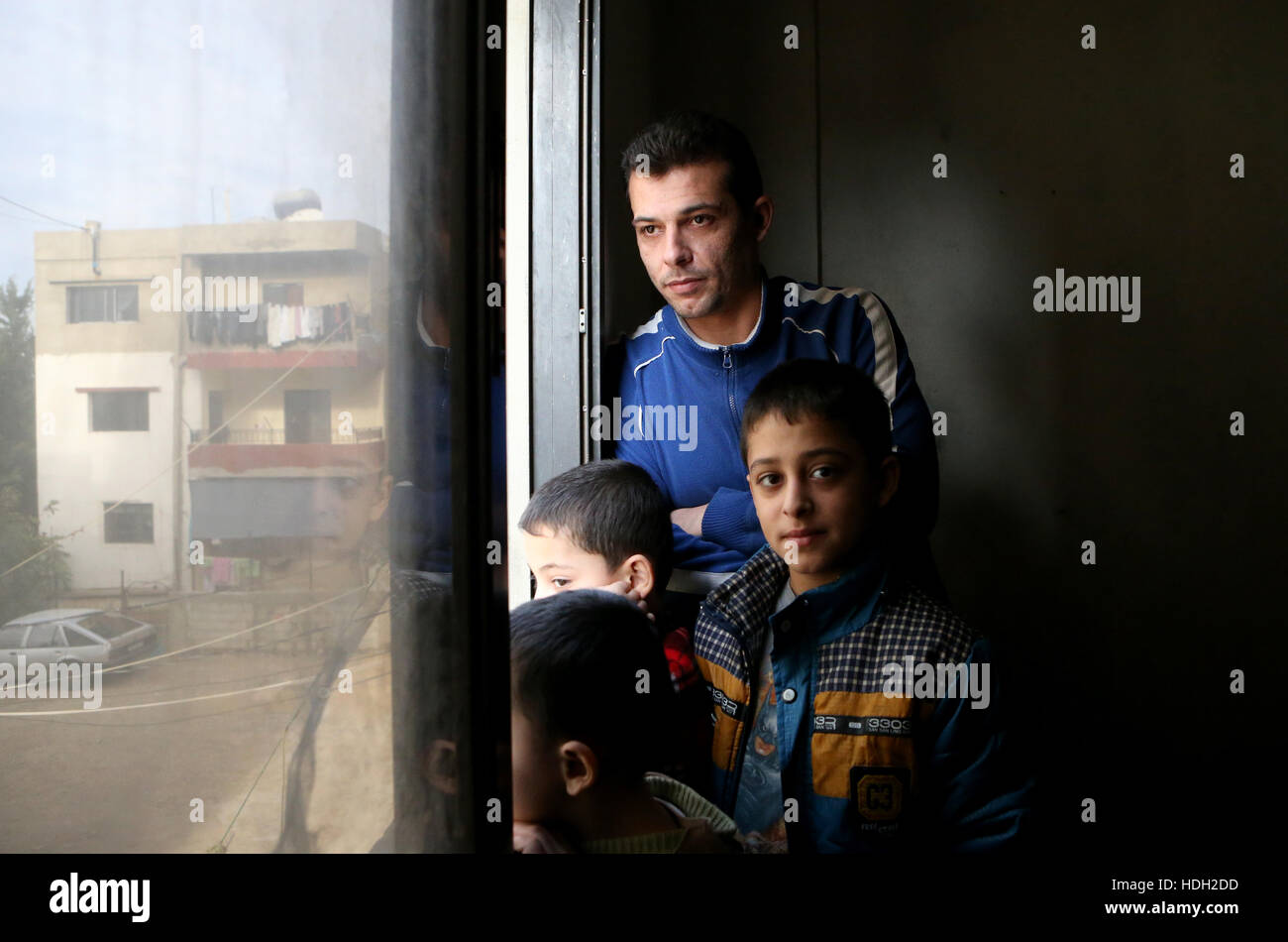 Syrian refugee Bassam Al Rahal, 30, with his sons (left to right) Ammar ...