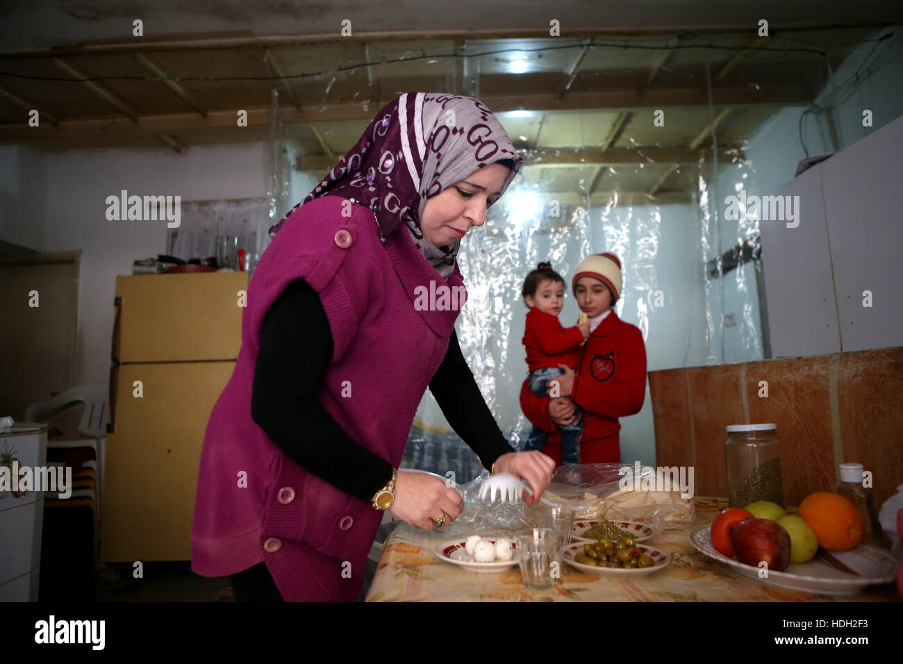 Syrian refugee Hanin Bathish Mtaweh, 13, right, with her mother ...
