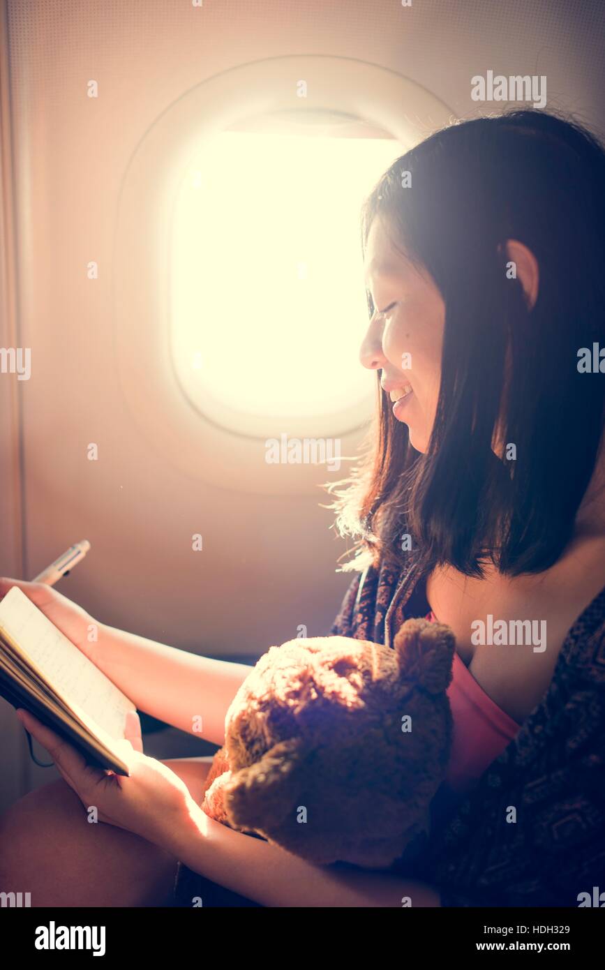 Woman Reading Writing Book Plane Concept Stock Photo - Alamy