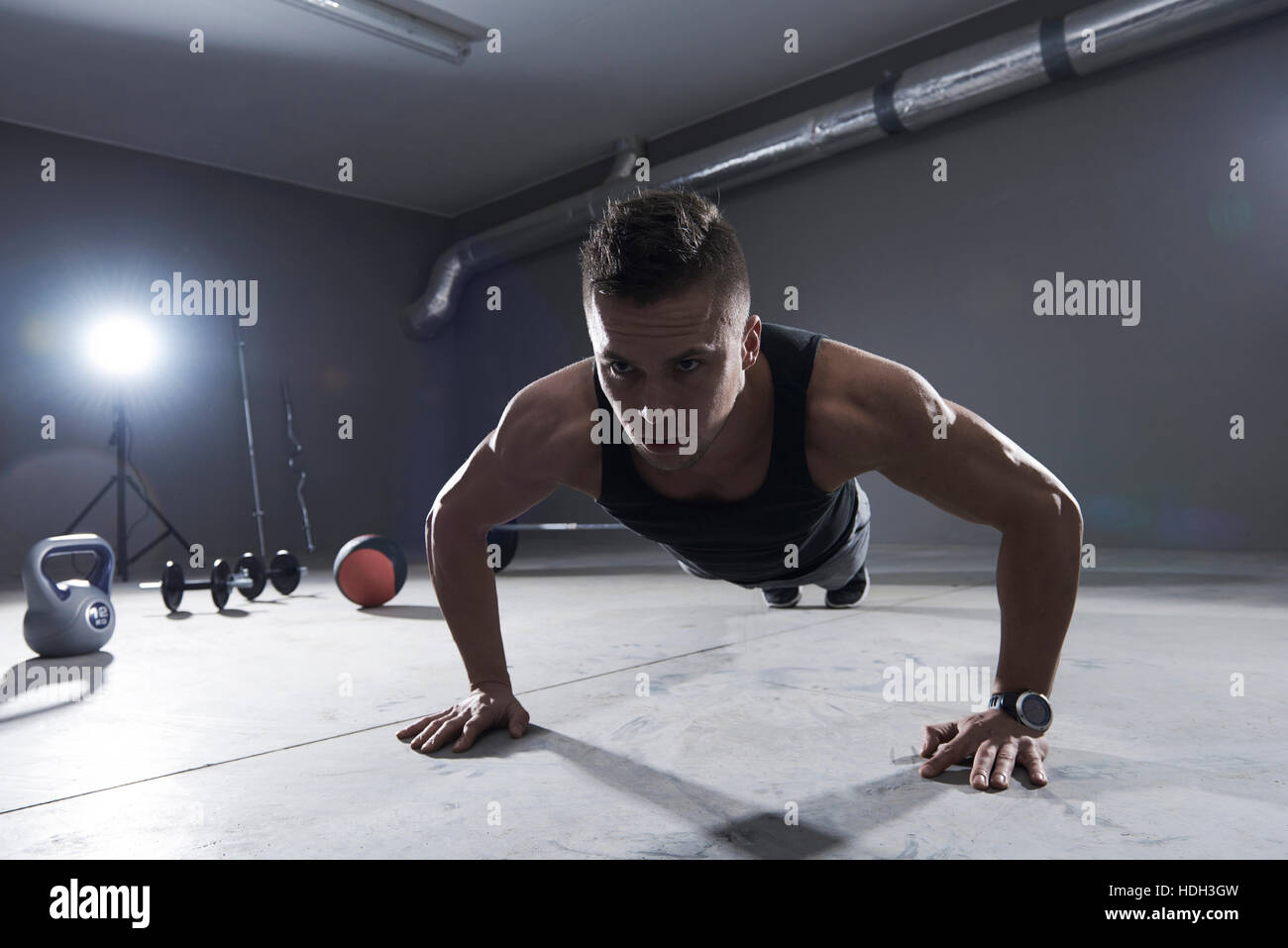 Push ups in the garage interior Stock Photo - Alamy