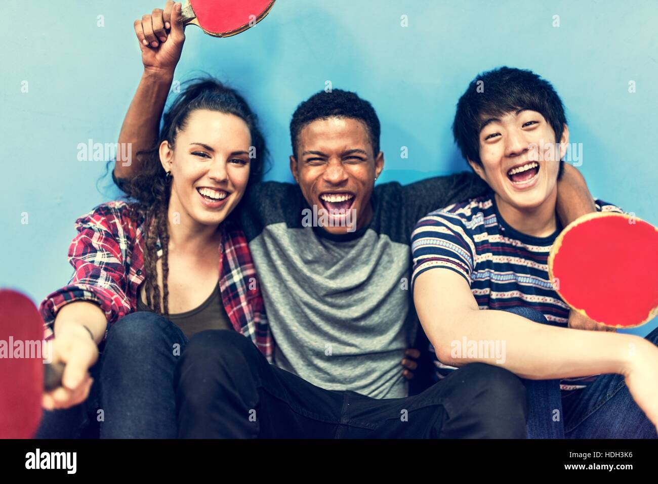 Diverse friends playing tennis hi-res stock photography and images - Alamy