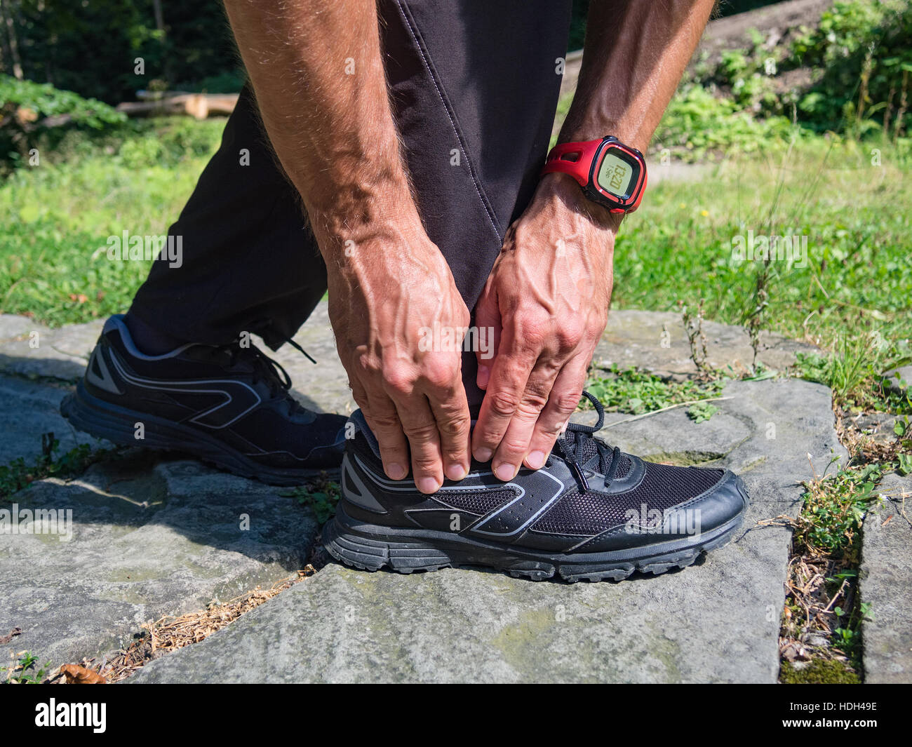 Foot pain from running Stock Photo - Alamy
