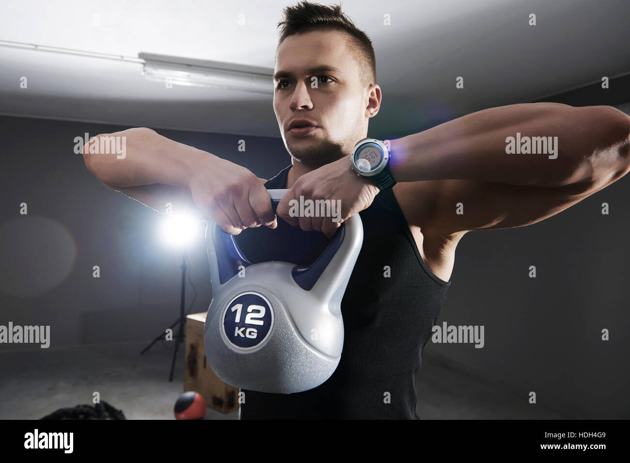 Shoulder muscle exercise with kettlebell Stock Photo - Alamy