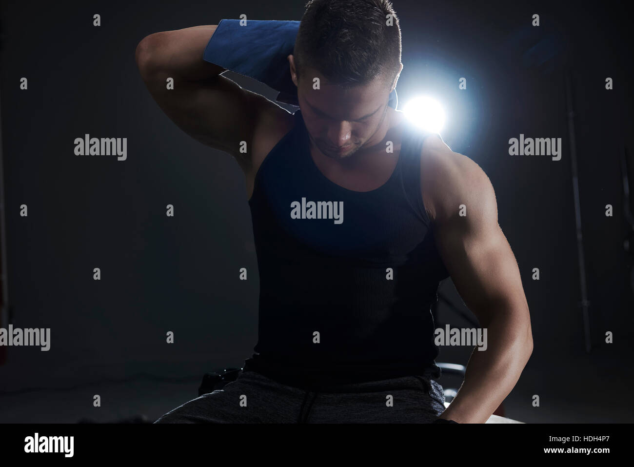 Handsome man resting after workout Stock Photo - Alamy