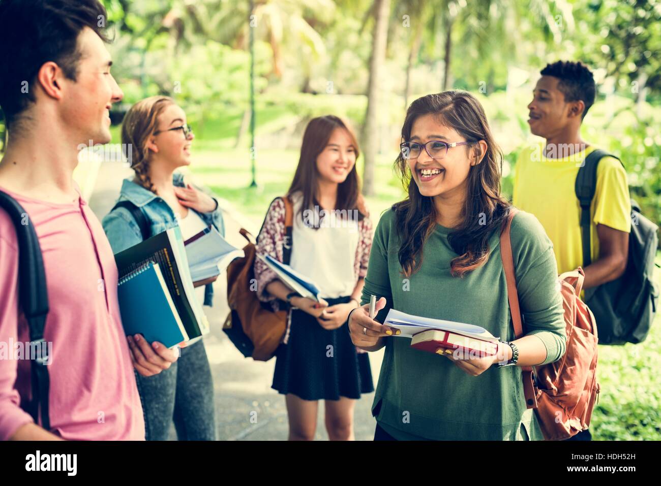 Diverse Young Students Book Outdoors Concept Stock Photo - Alamy