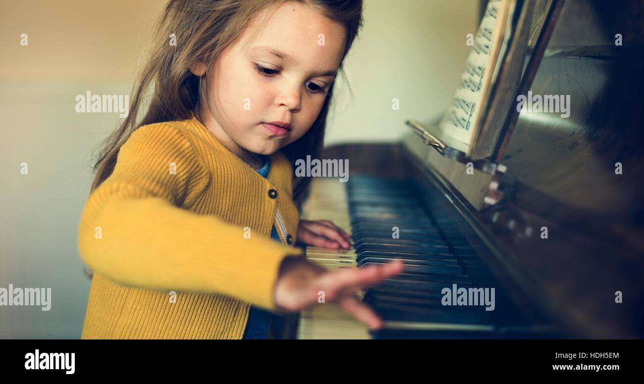 Adorable Cute Girl Playing Piano Concept Stock Photo - Alamy