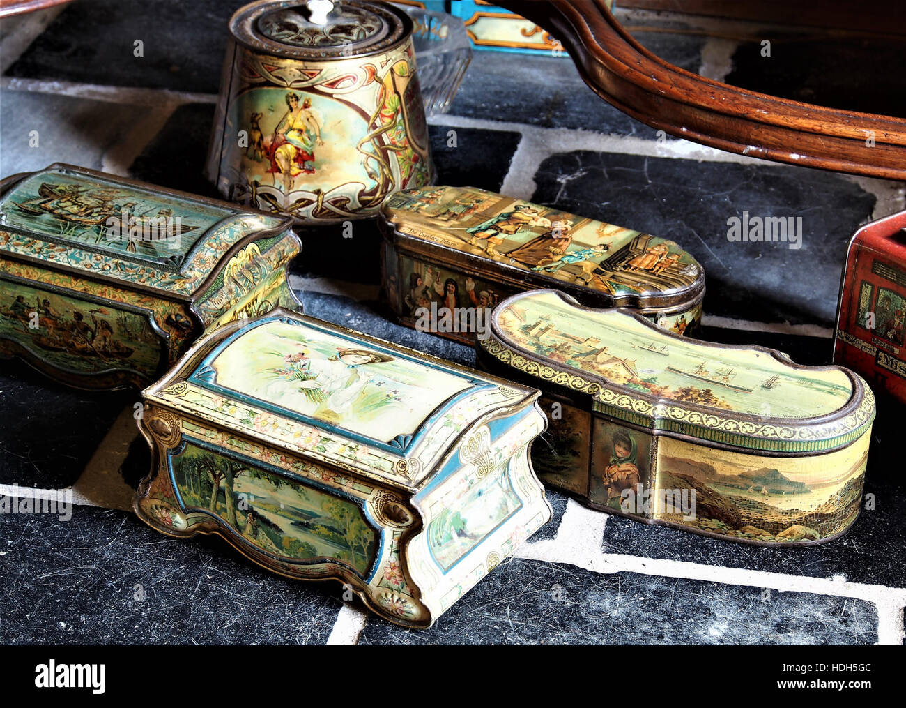 This image captures a collection of very old cans displayed at the ...