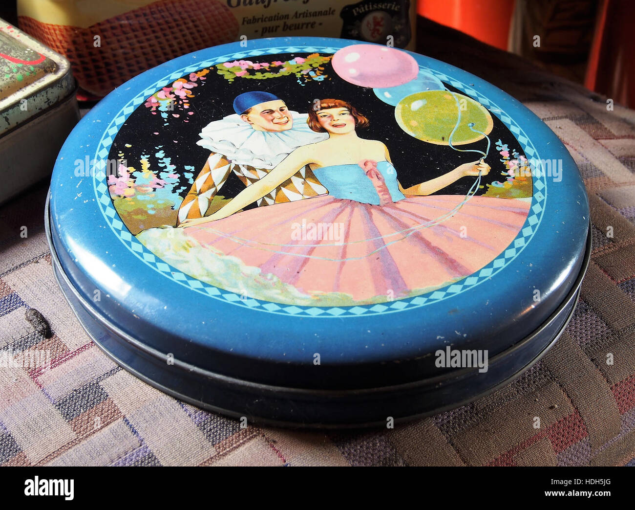 The image shows an old tin piece, displayed at the Museum of Yvette ...