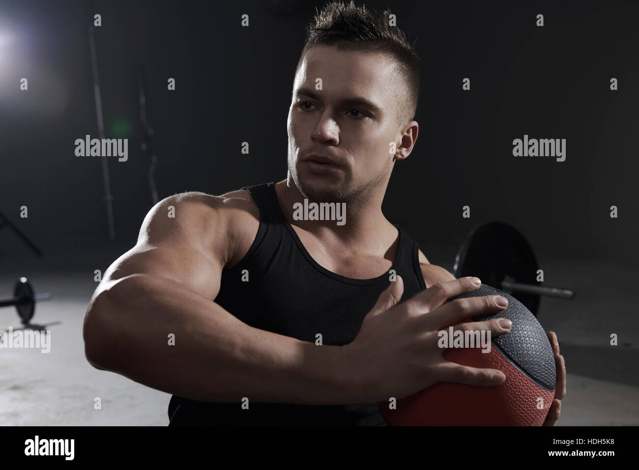 Muscles man holding hi-res stock photography and images - Alamy