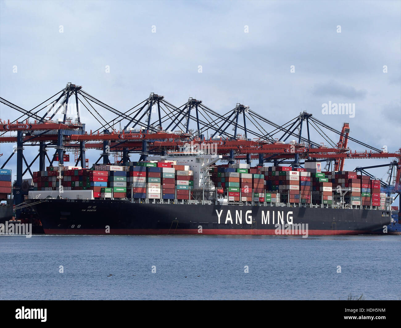 This image shows the YM Worth, a container ship, docked at the Port of Rotterdam in 2015 ...