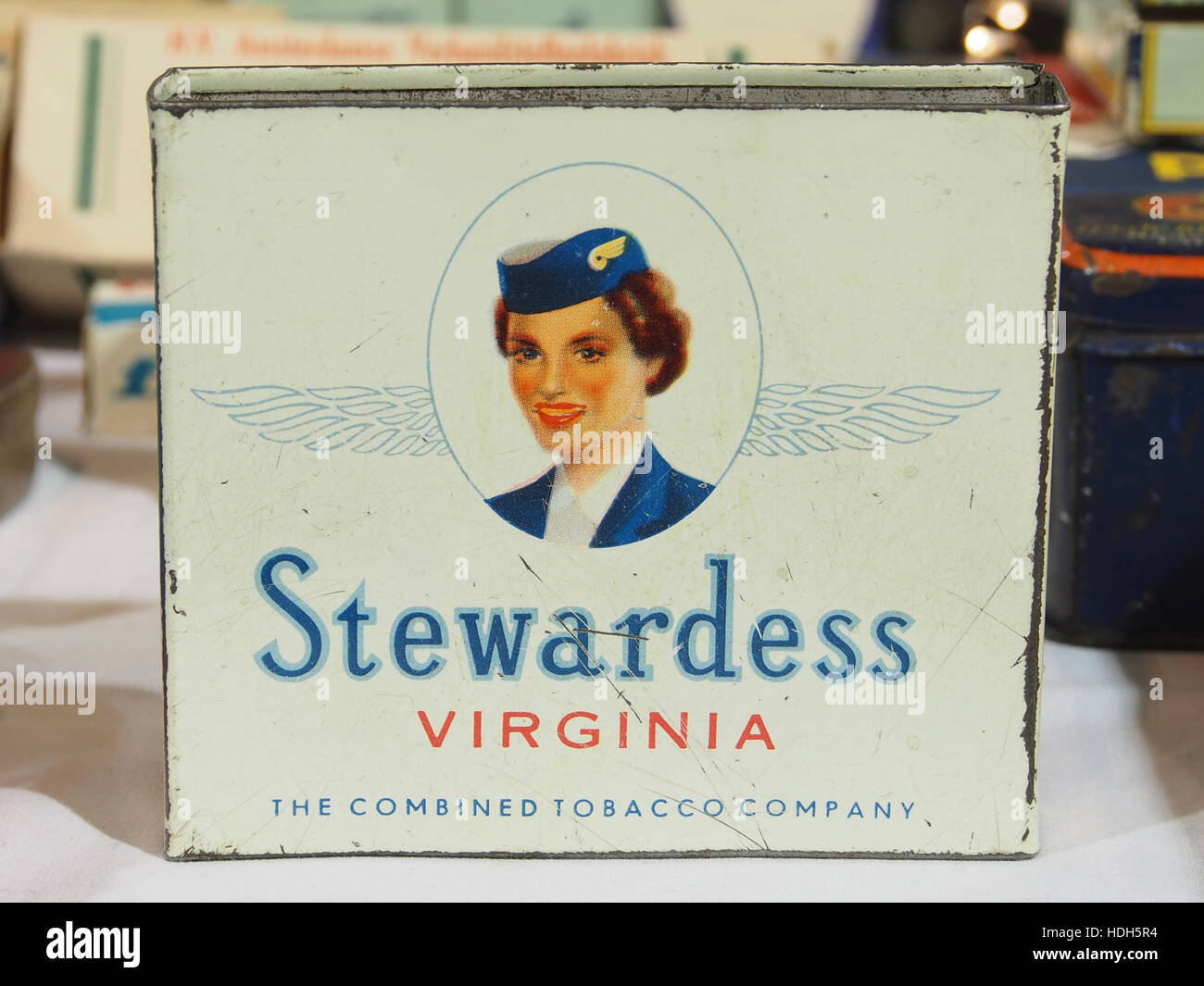 This image shows a vintage tin of Stewardess cigarettes, a collectible ...