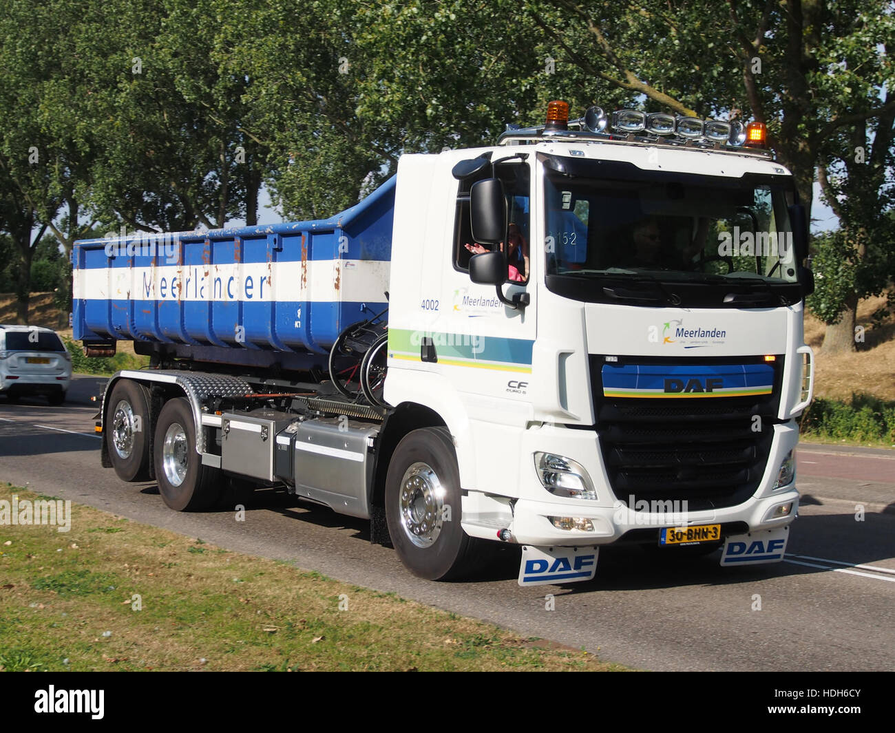 A variety of large transport trucks are seen in this image ...