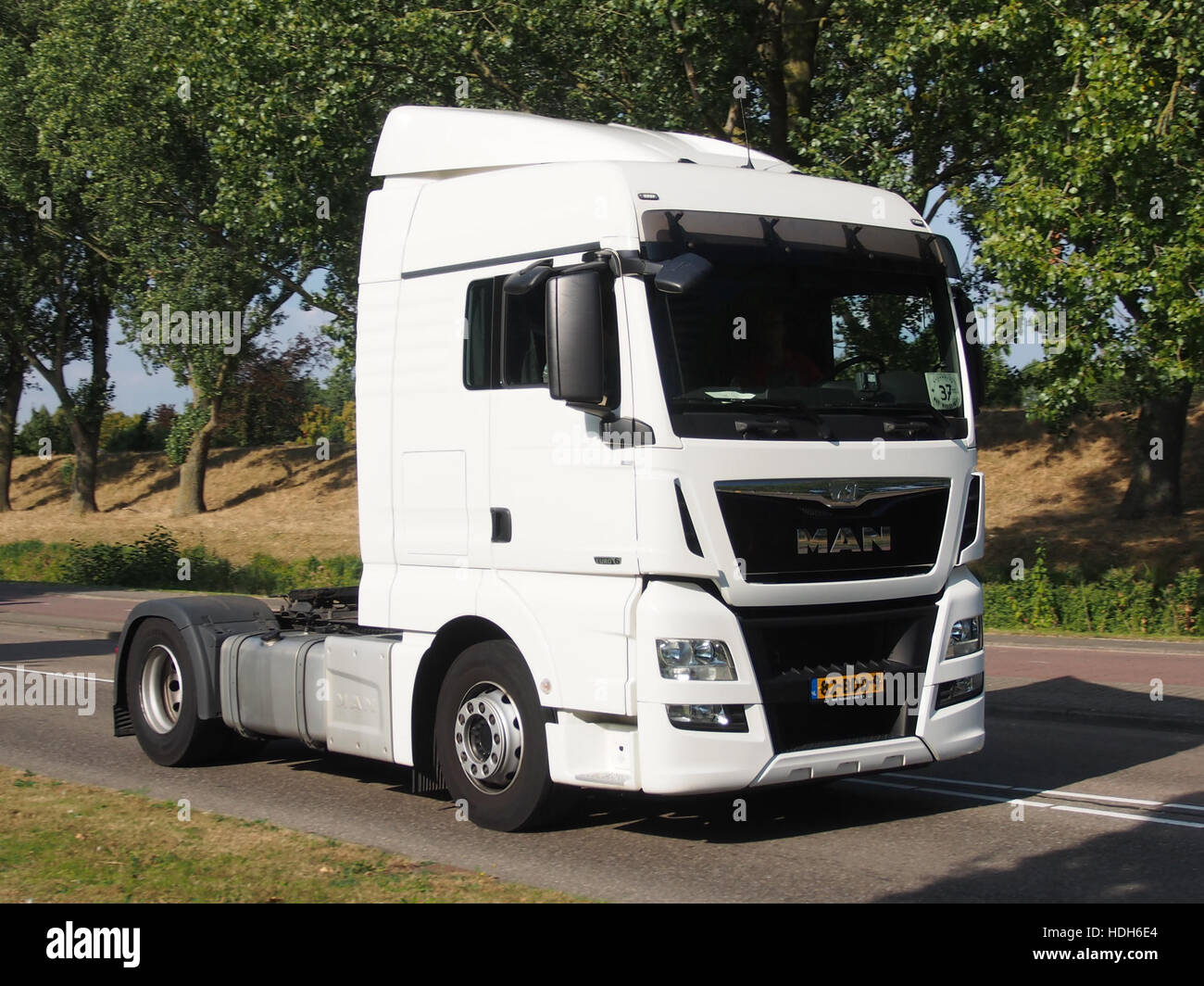 This image depicts a large truck involved in vehicle transport ...