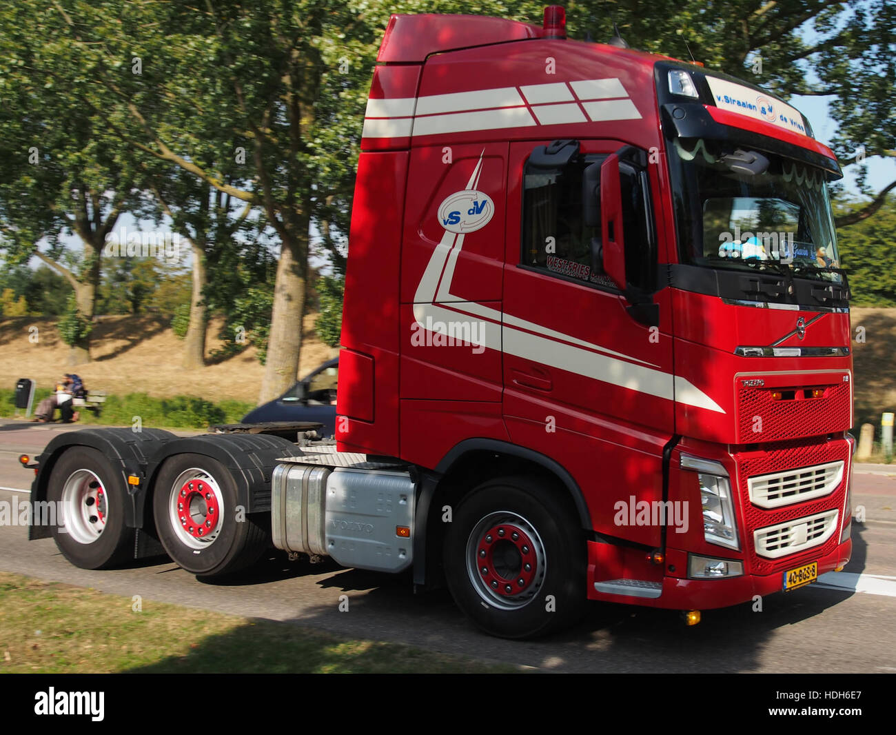 This photograph shows a large truck involved in vehicle transport ...