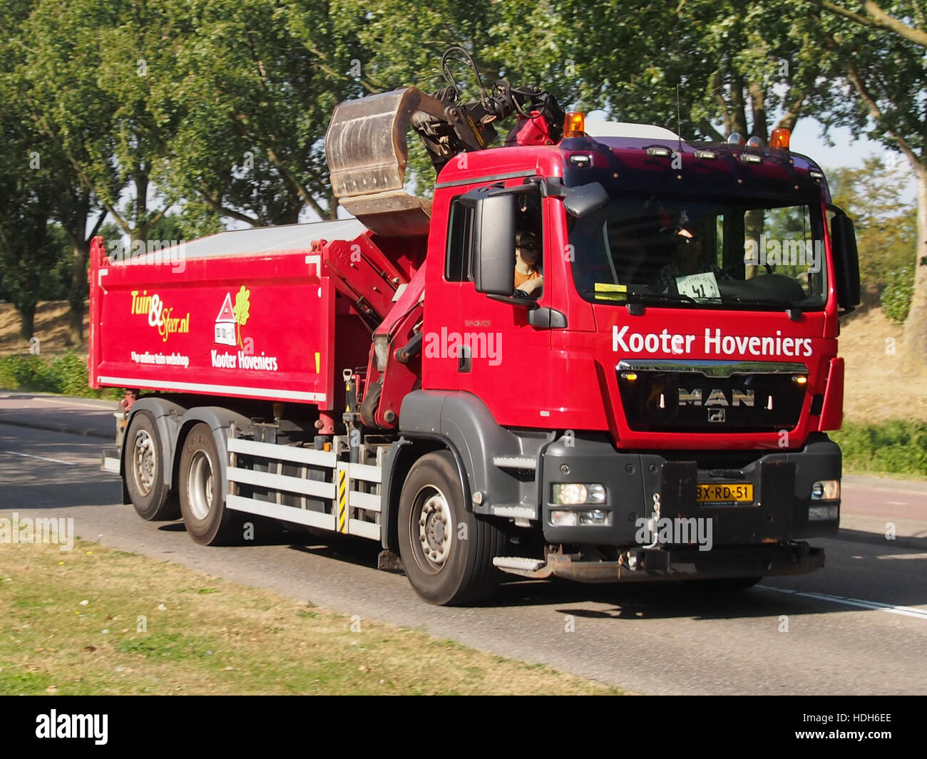 A large vehicle transport truck, often used for transporting oversized ...
