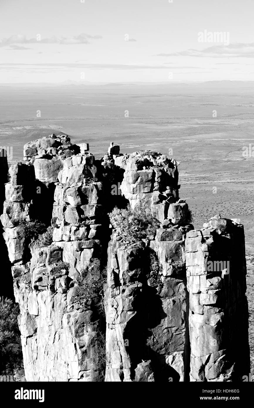 blur in south africa valley of desolation dirty road rock tree and sky ...