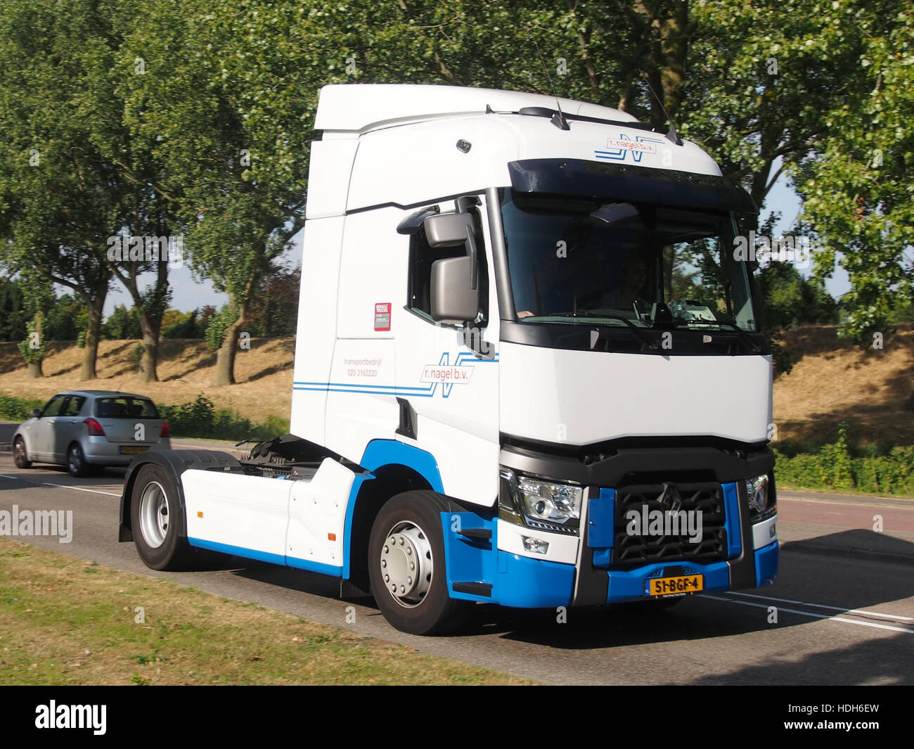 This image depicts a large truck used for vehicle transport, designed ...