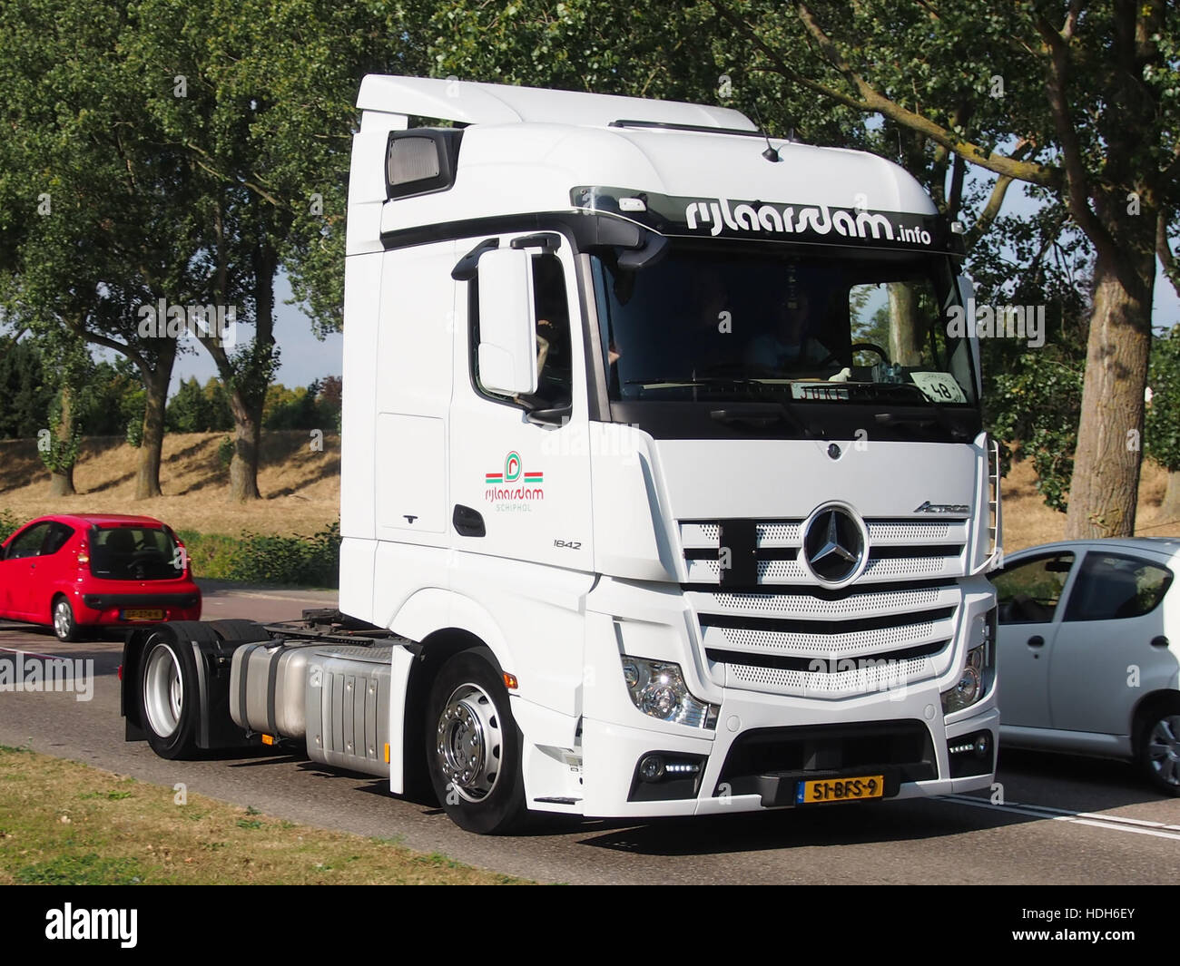 This image captures a large truck in the process of transporting goods ...