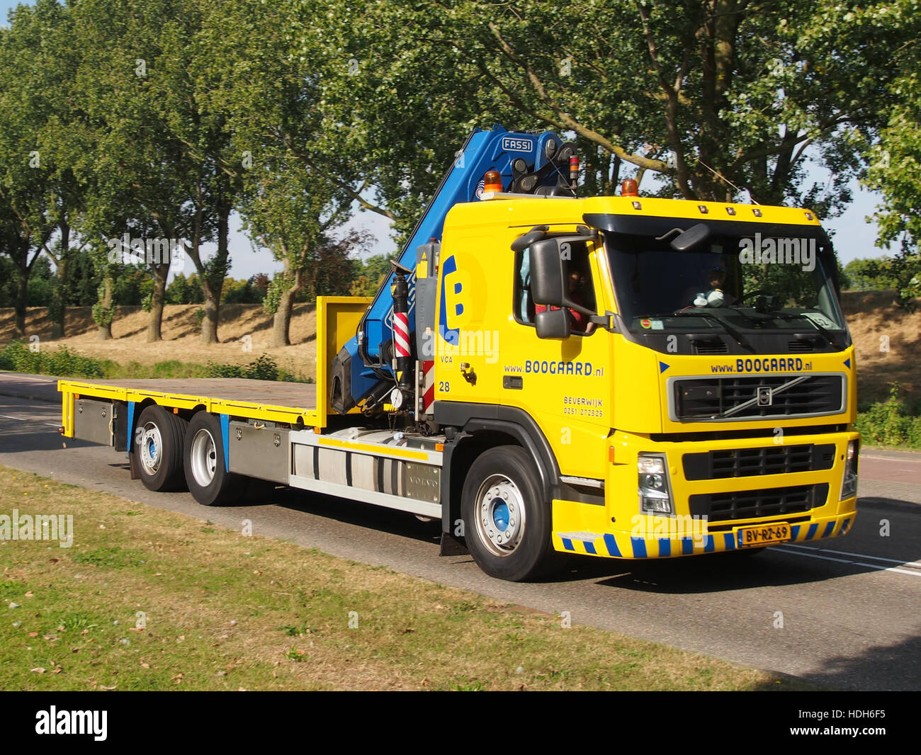 This image depicts a large truck involved in vehicle transport ...