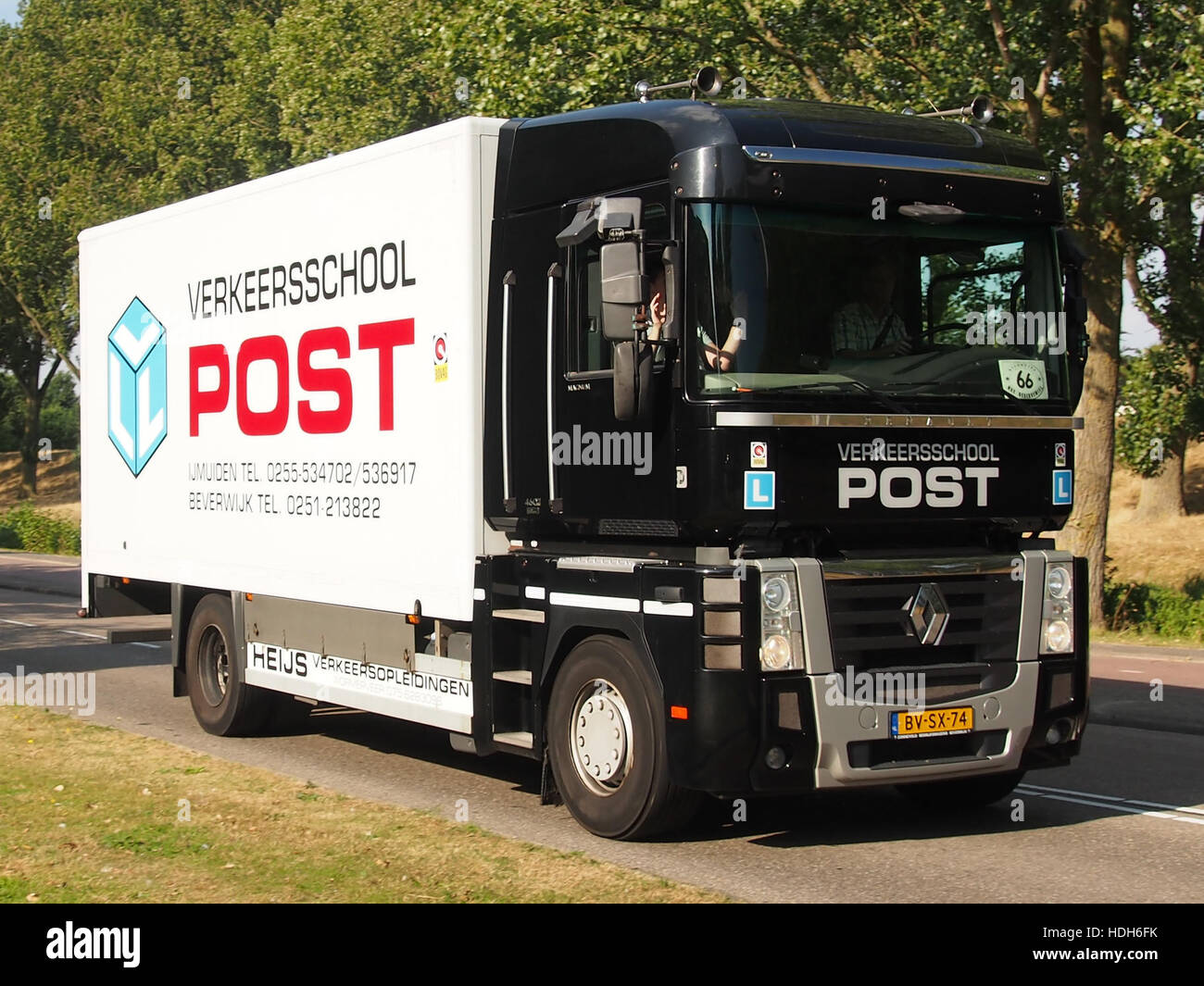 This large vehicle is involved in transporting goods, designed to carry ...