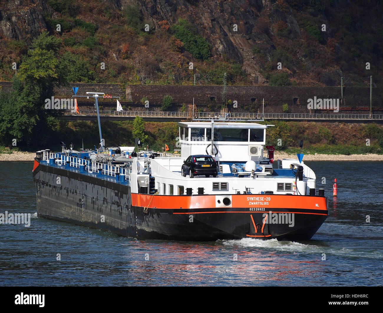 This image shows a ship navigating the Rhine River, a major European ...