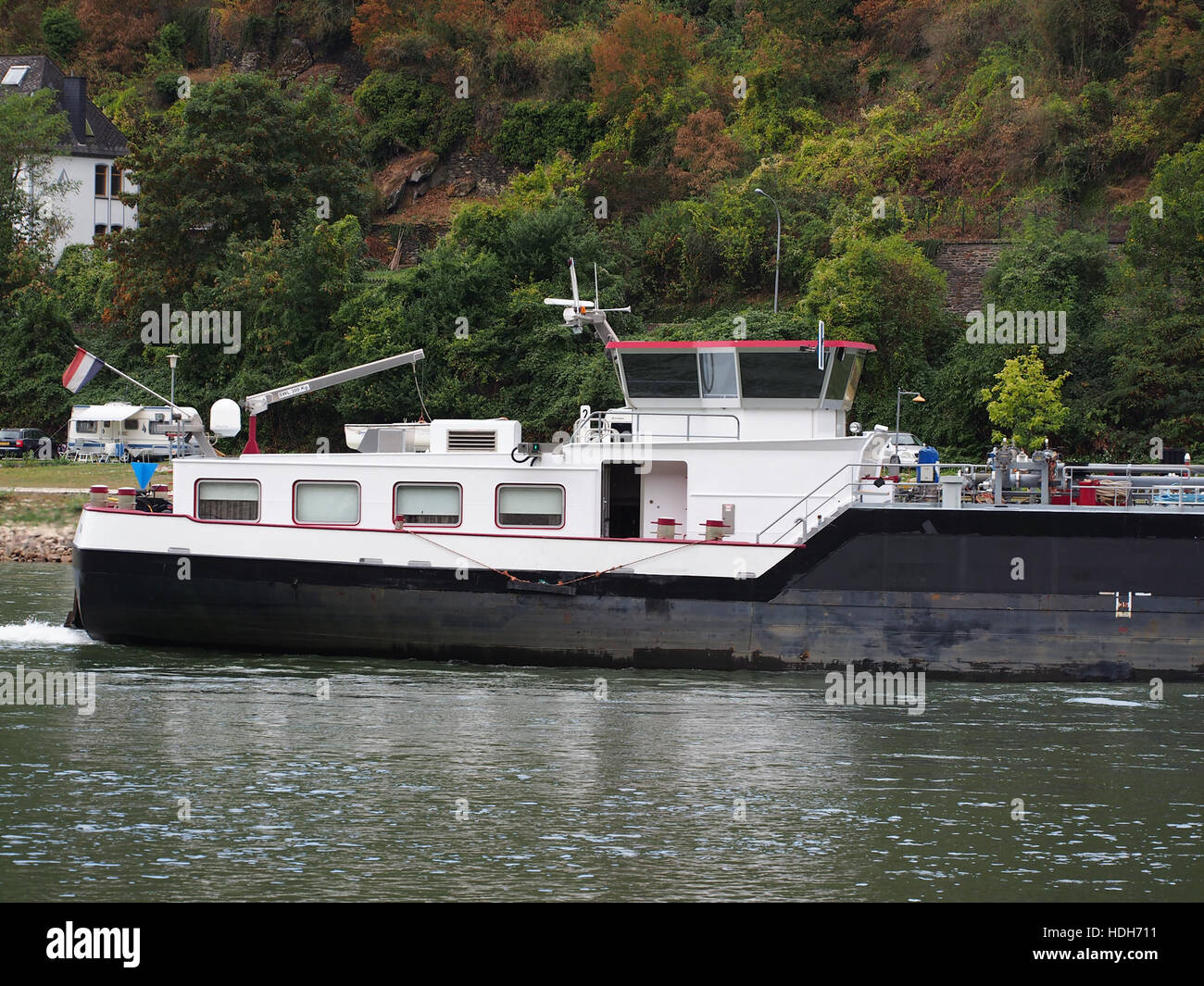 This image depicts a ship navigating the Rhine River, one of Europe’s ...